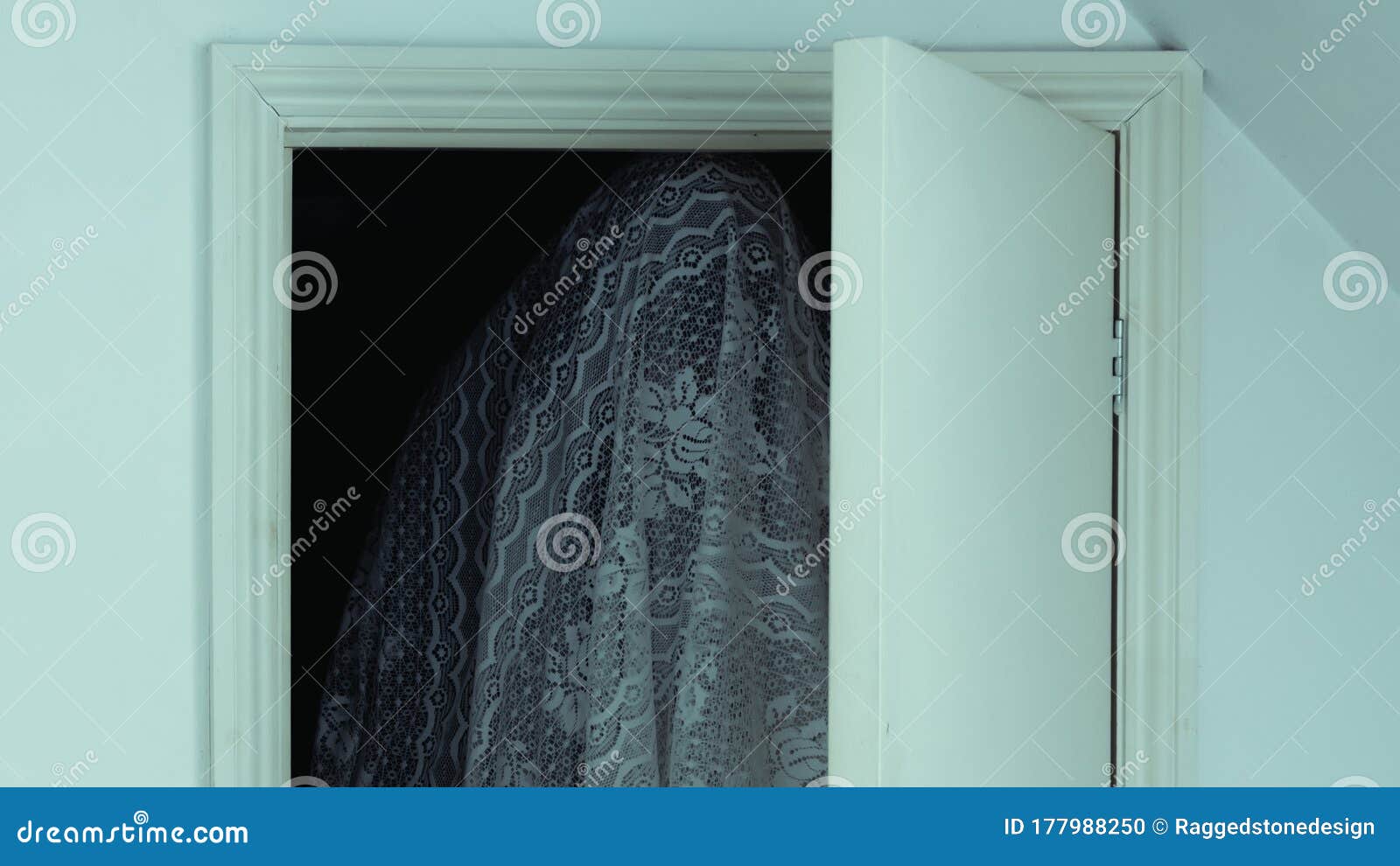 A Spooky Ghost with a Sheet Over Them. Standing in a Closet with the ...