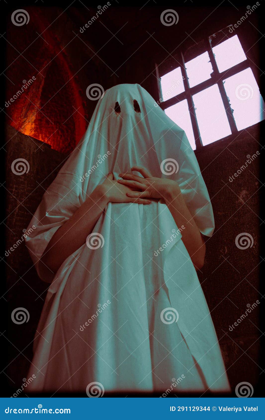 A Spooky Ghost Standing in a Crypt Illuminated by an Otherworldly Red ...