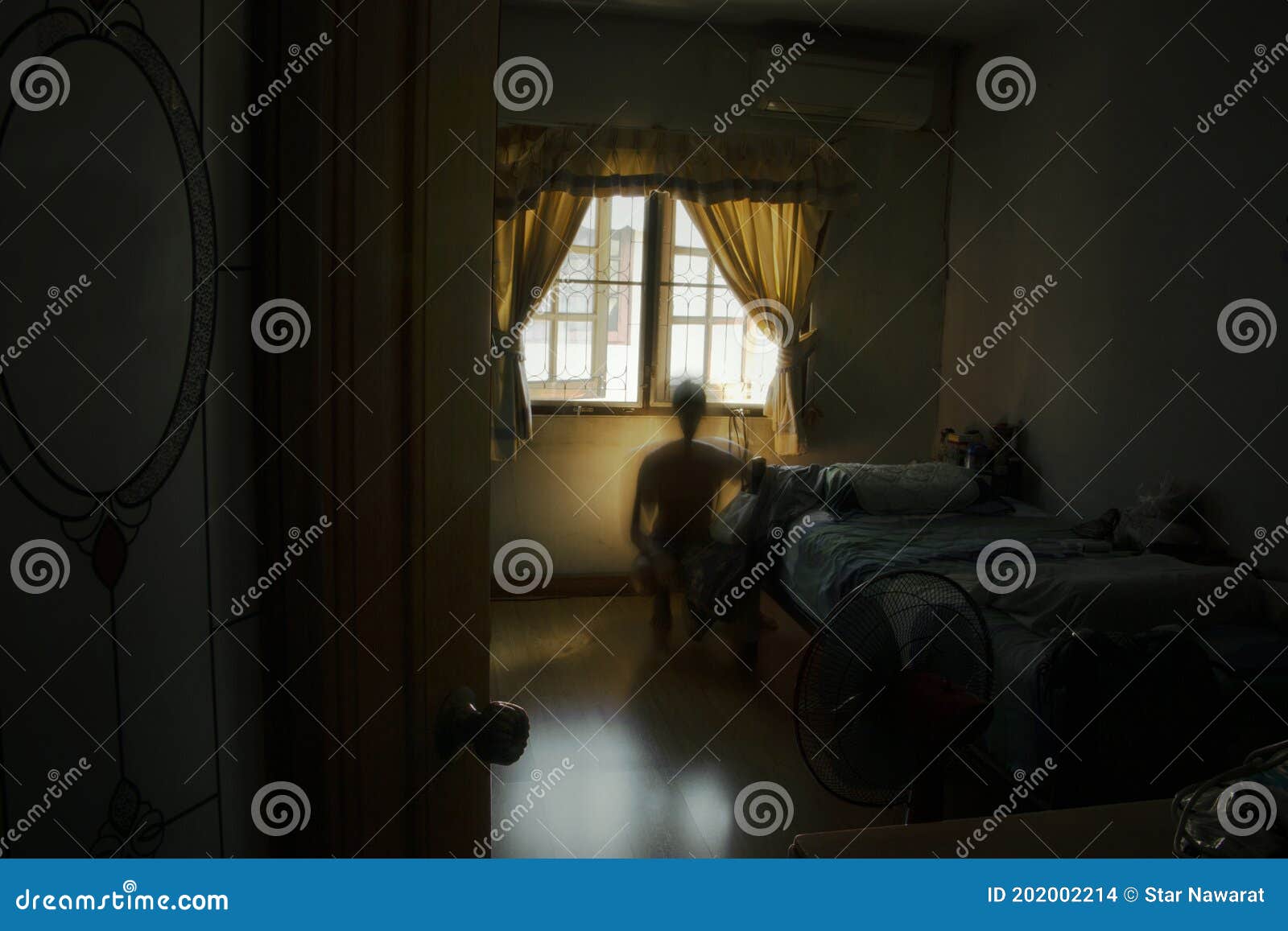 A Spooky Shadow Squatting Behind the Bed Stock Photo - Image of inside ...