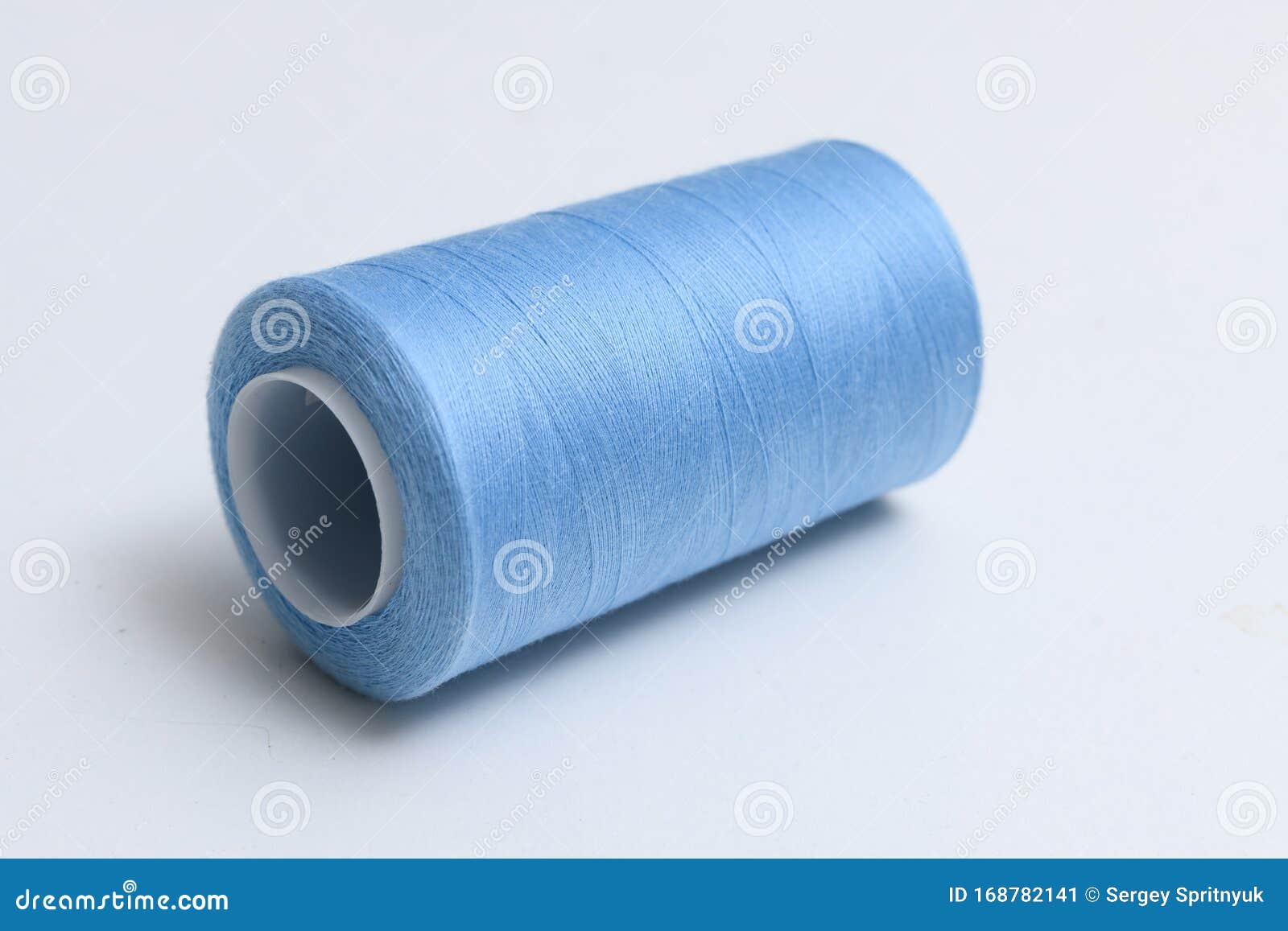 Spool of Blue Synthetic or Cotton Threads on White Background. Spool of ...