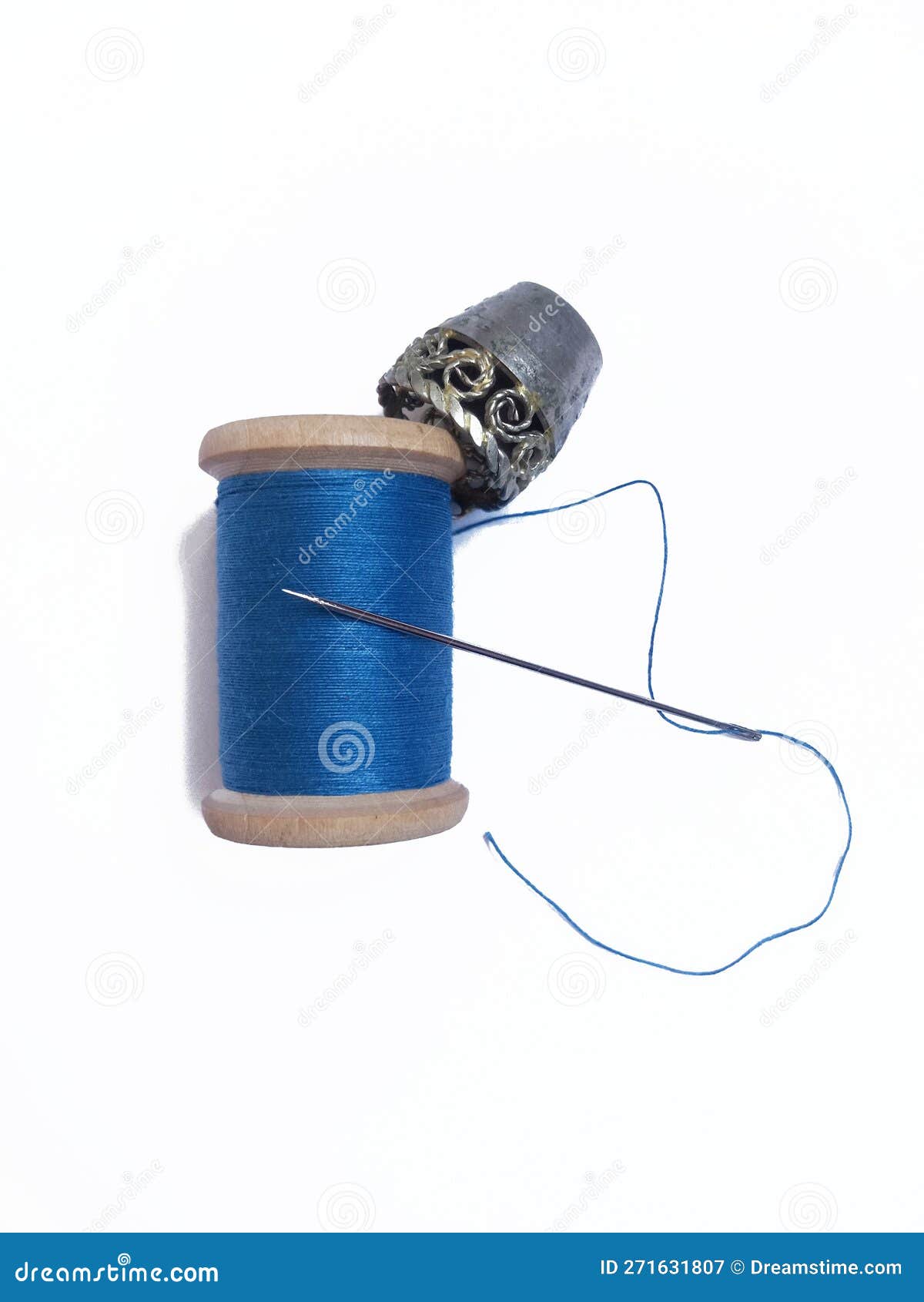 A Spool of Blue Thread, Thimble and Needle Stock Image - Image of ...