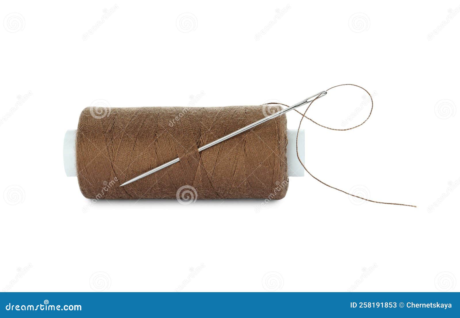 Spool of Brown Sewing Thread with Needle Isolated on White Stock Image ...