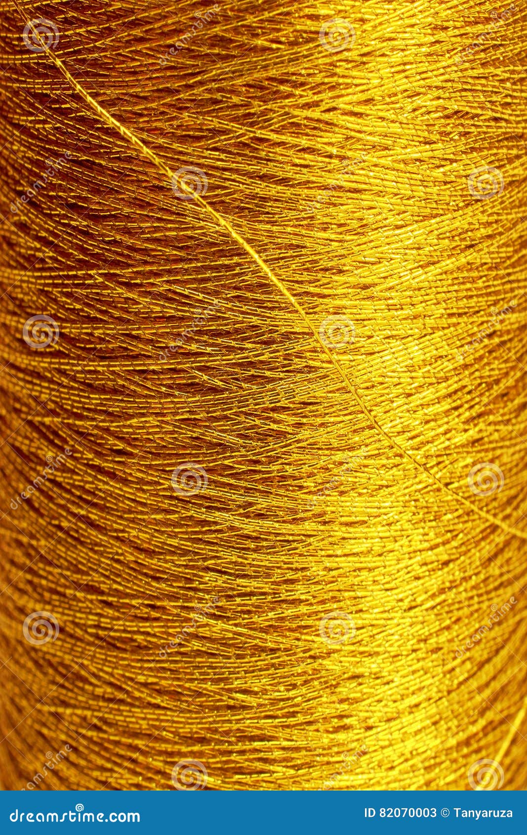 The Spool of Gold Thread Closeup Vertical Stock Image - Image of ...