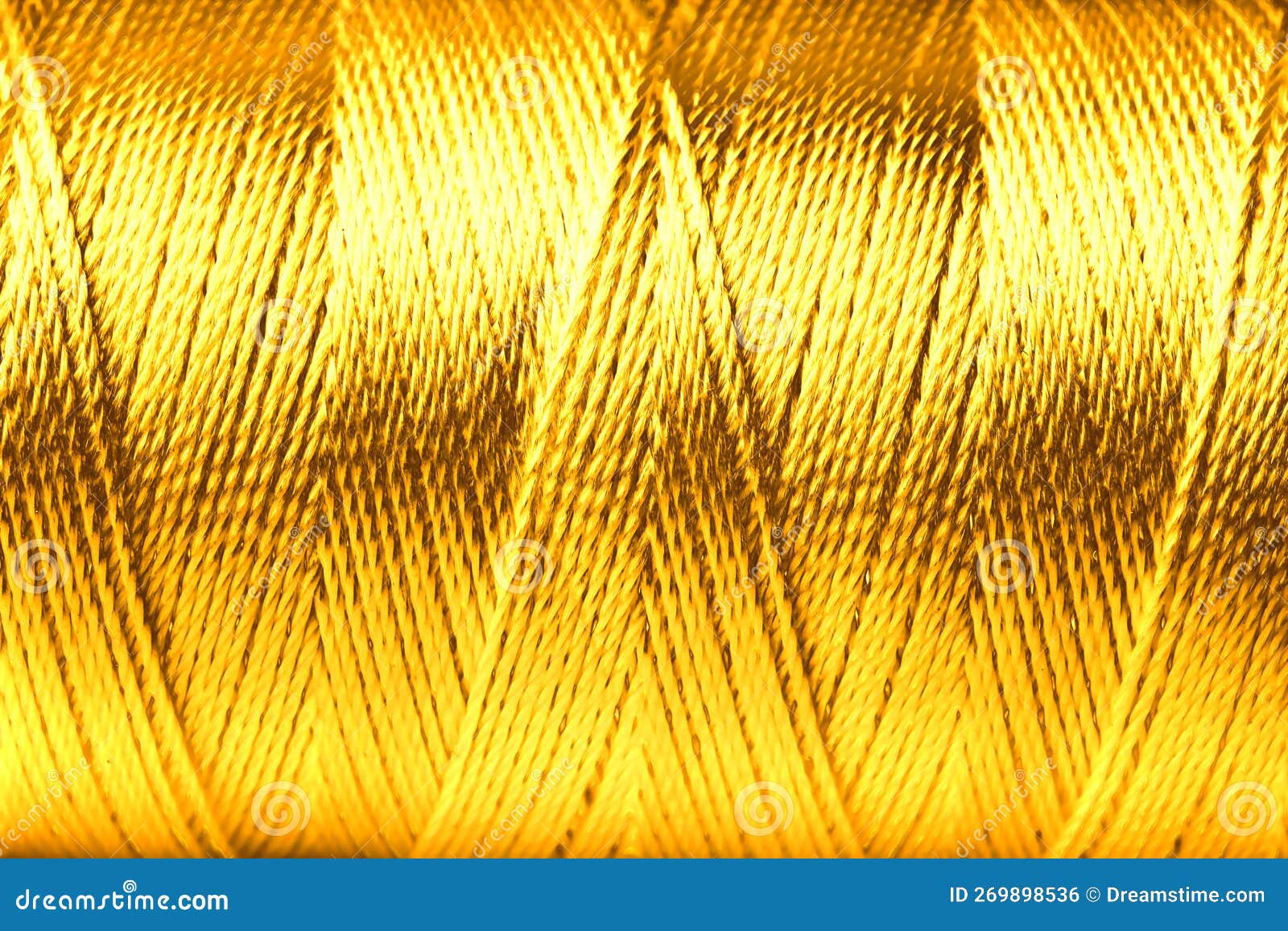 Spool of Golden Sewing Thread As Background, Closeup Stock Photo ...