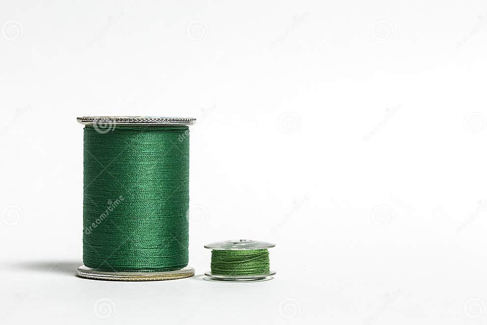 Spool of Green Thread with Bobbin Stock Photo - Image of silver, still ...
