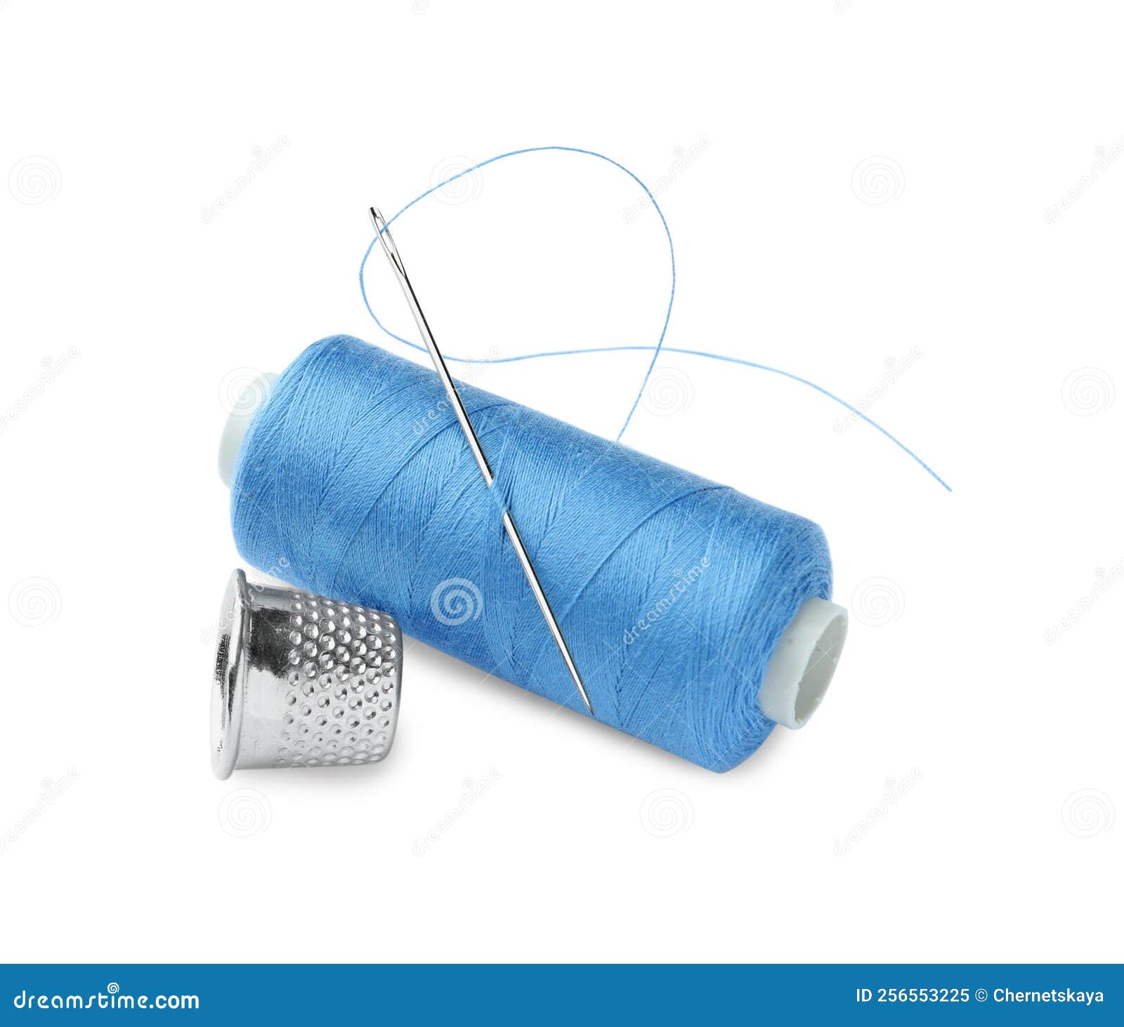 Spool of Light Blue Sewing Thread with Needle and Thimble on White ...