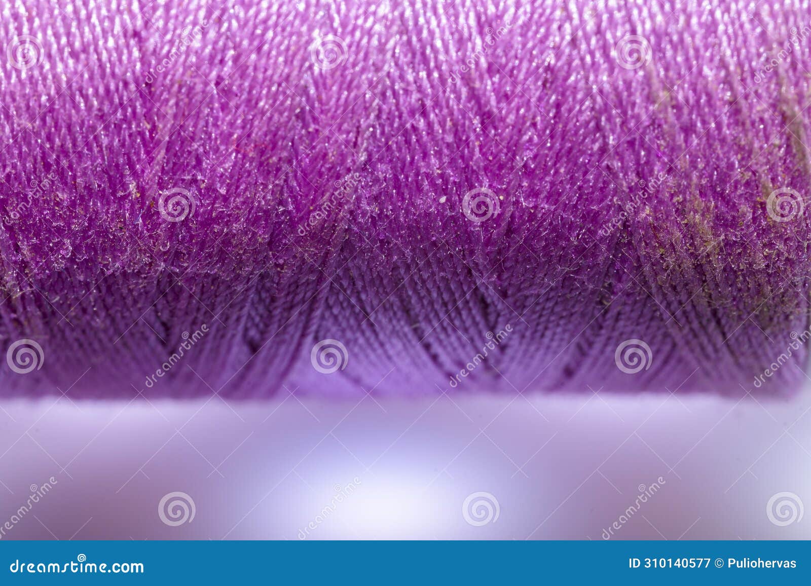 Spool of Purple Thread for Sewing with White Background Horizontally ...