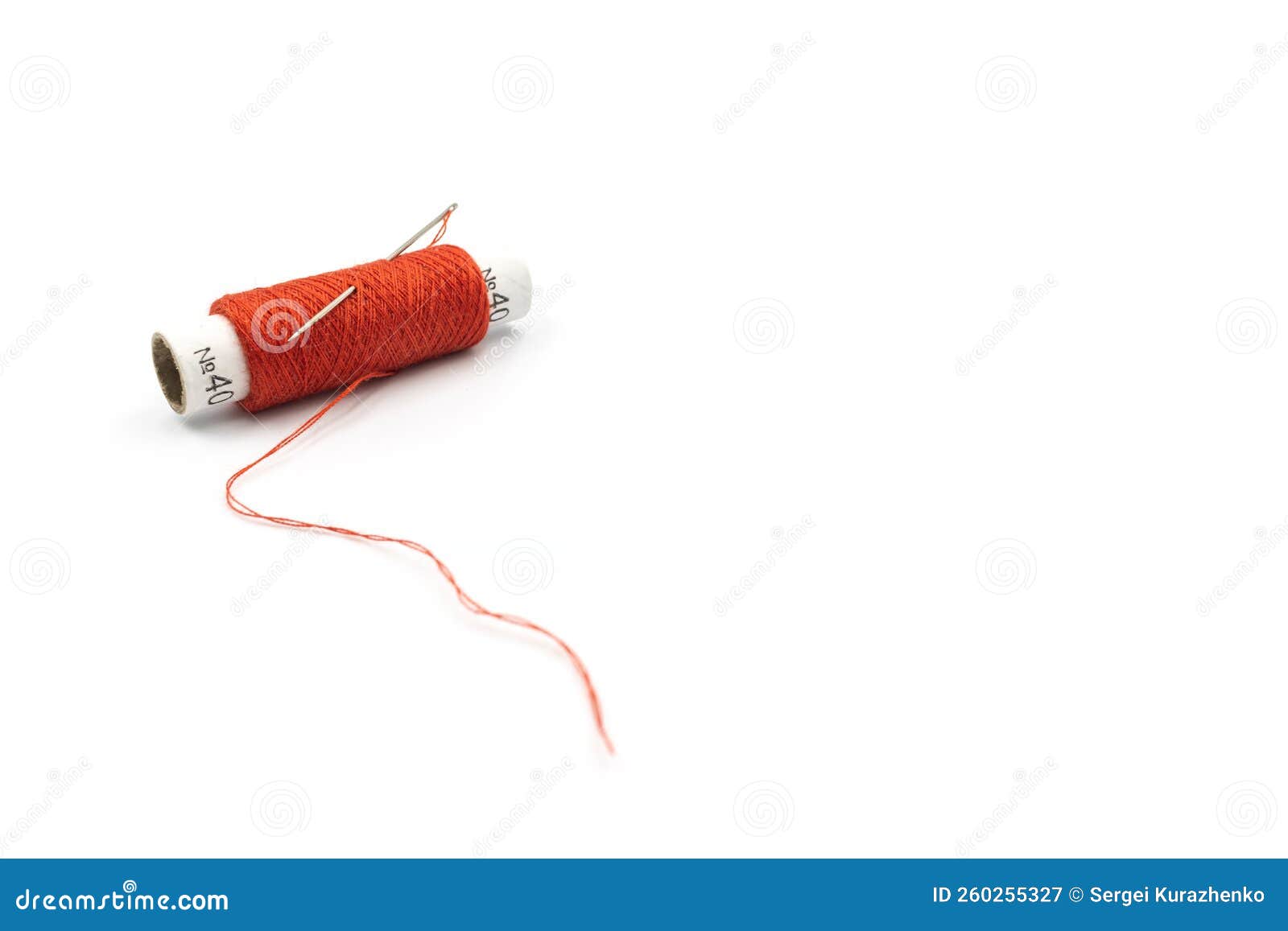 Spool of Red Thread with a Needle Isolated on White Background. Red ...