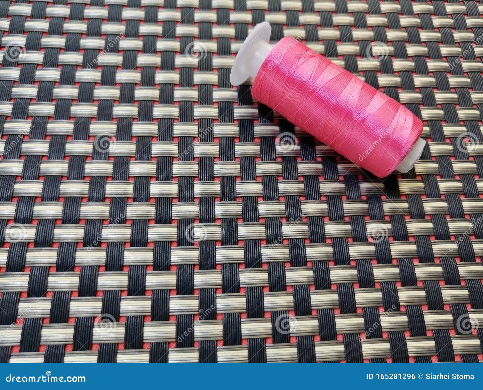 Spool of Silk Pink Thread on a Structural Black Background Stock Photo ...