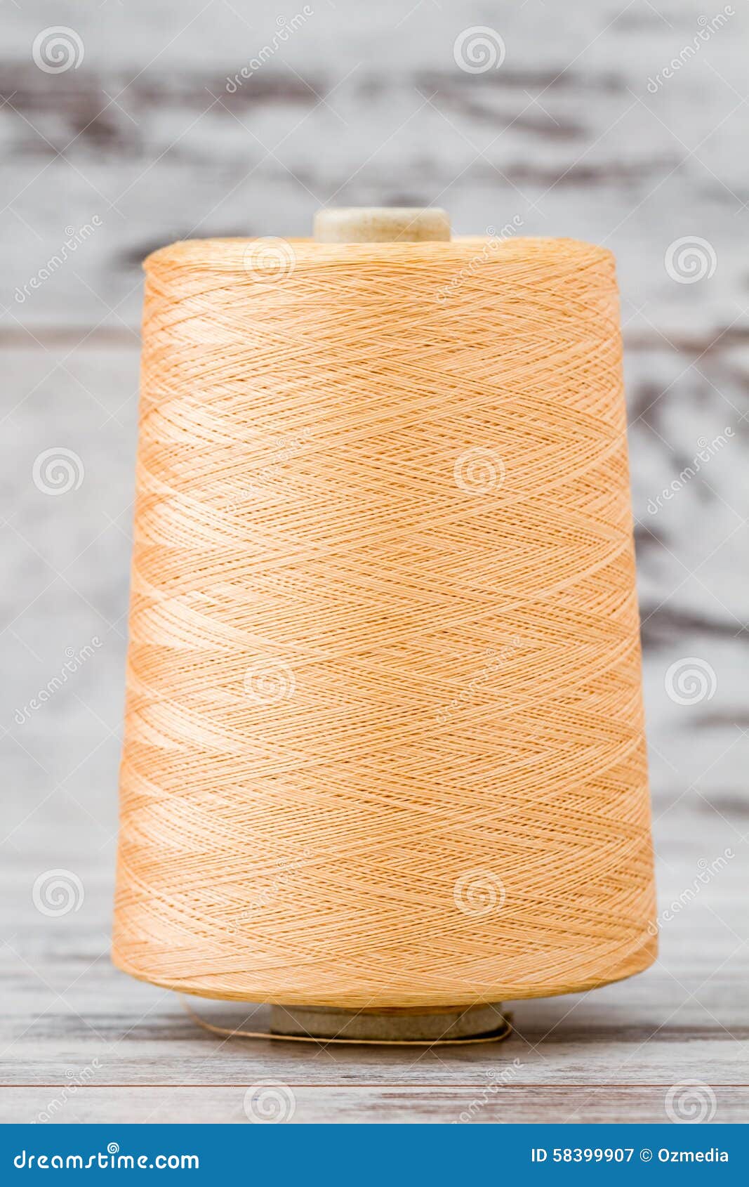 Spool of Synthetic Orange Thread on White Wooden Background Stock Image ...