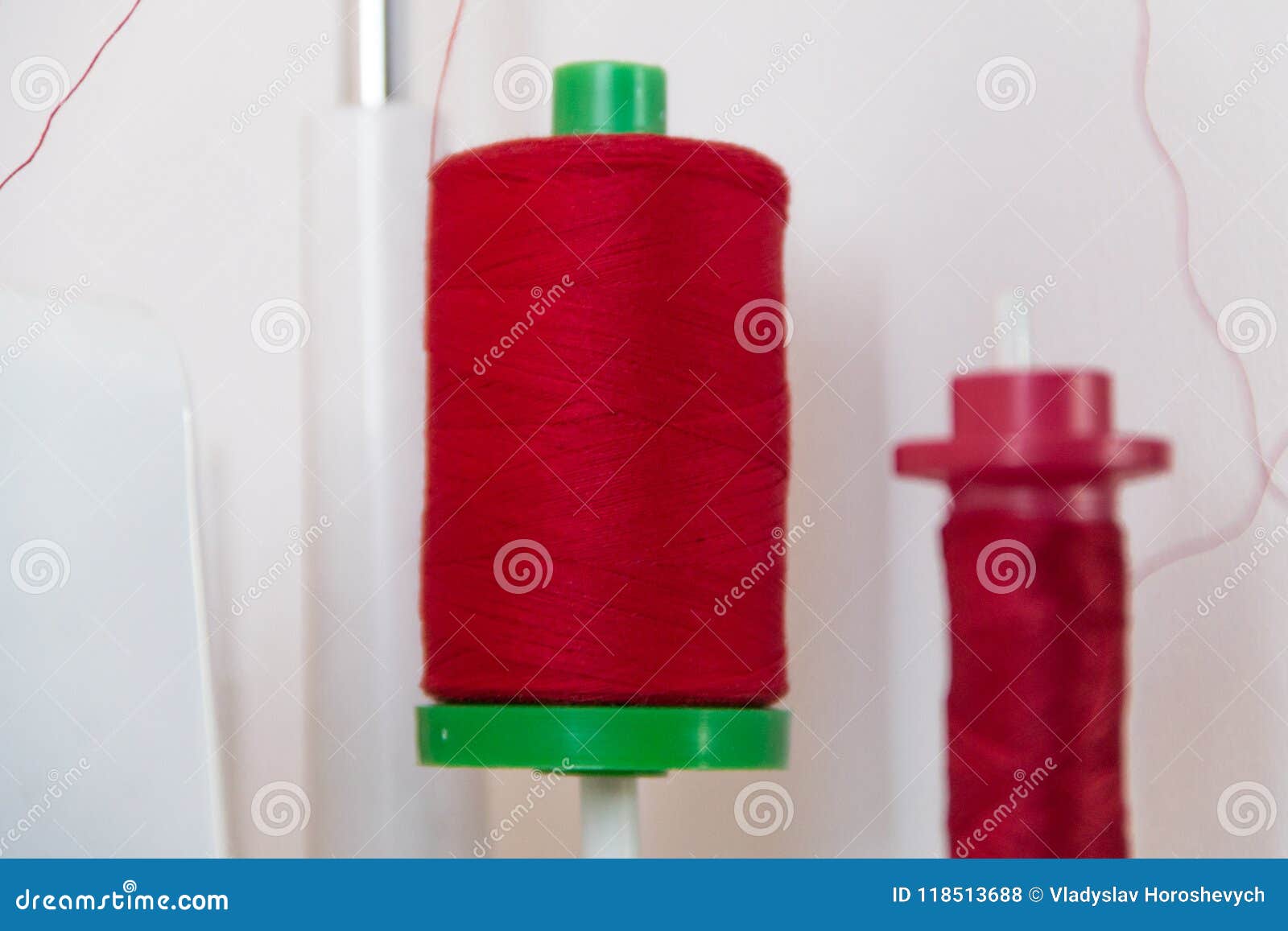 Spool of Thread and Needle, Red Spool of Thread Mounted on the Sewing ...