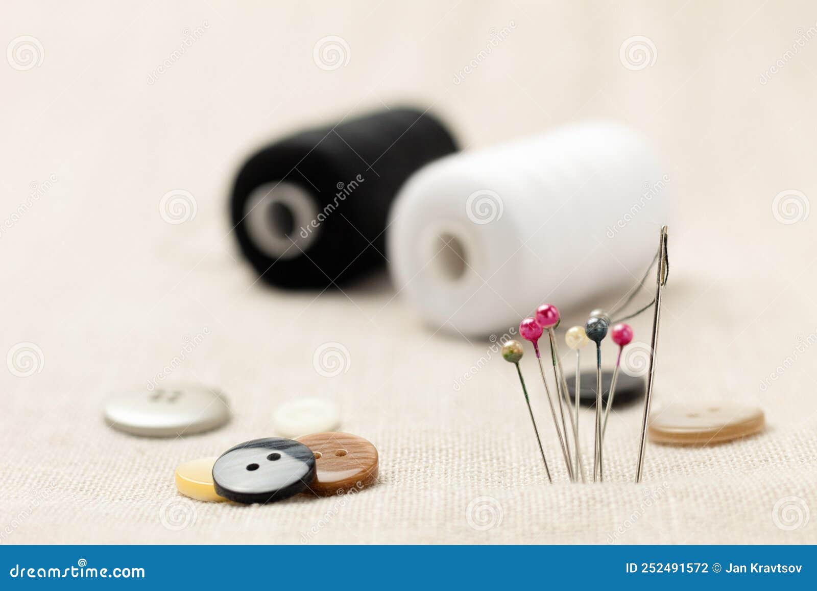 Spool of Thread and Needles for Sewing, Close-up Stock Photo - Image of ...