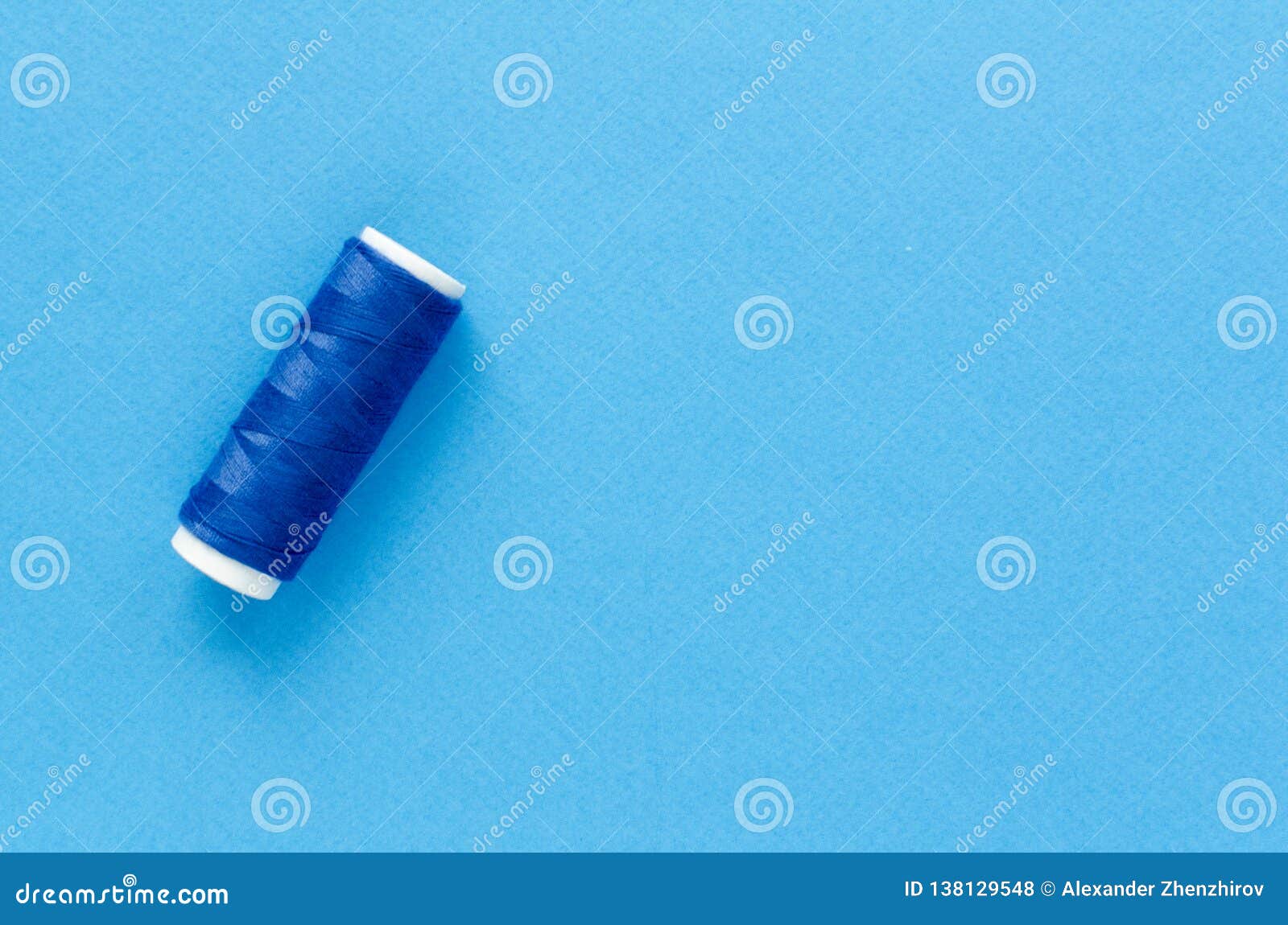 Spool of Thread on Paper Background Stock Photo - Image of orange ...