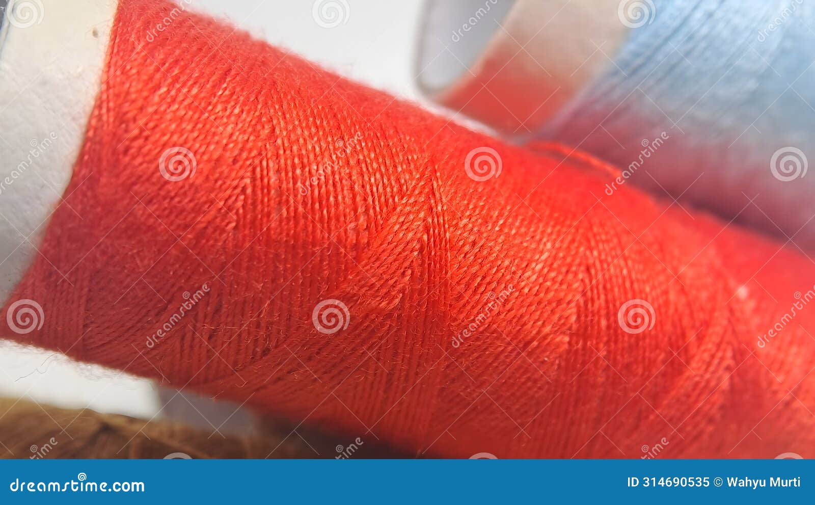 A Spool of Thread with Red and Blue Colors Stock Image - Image of ...
