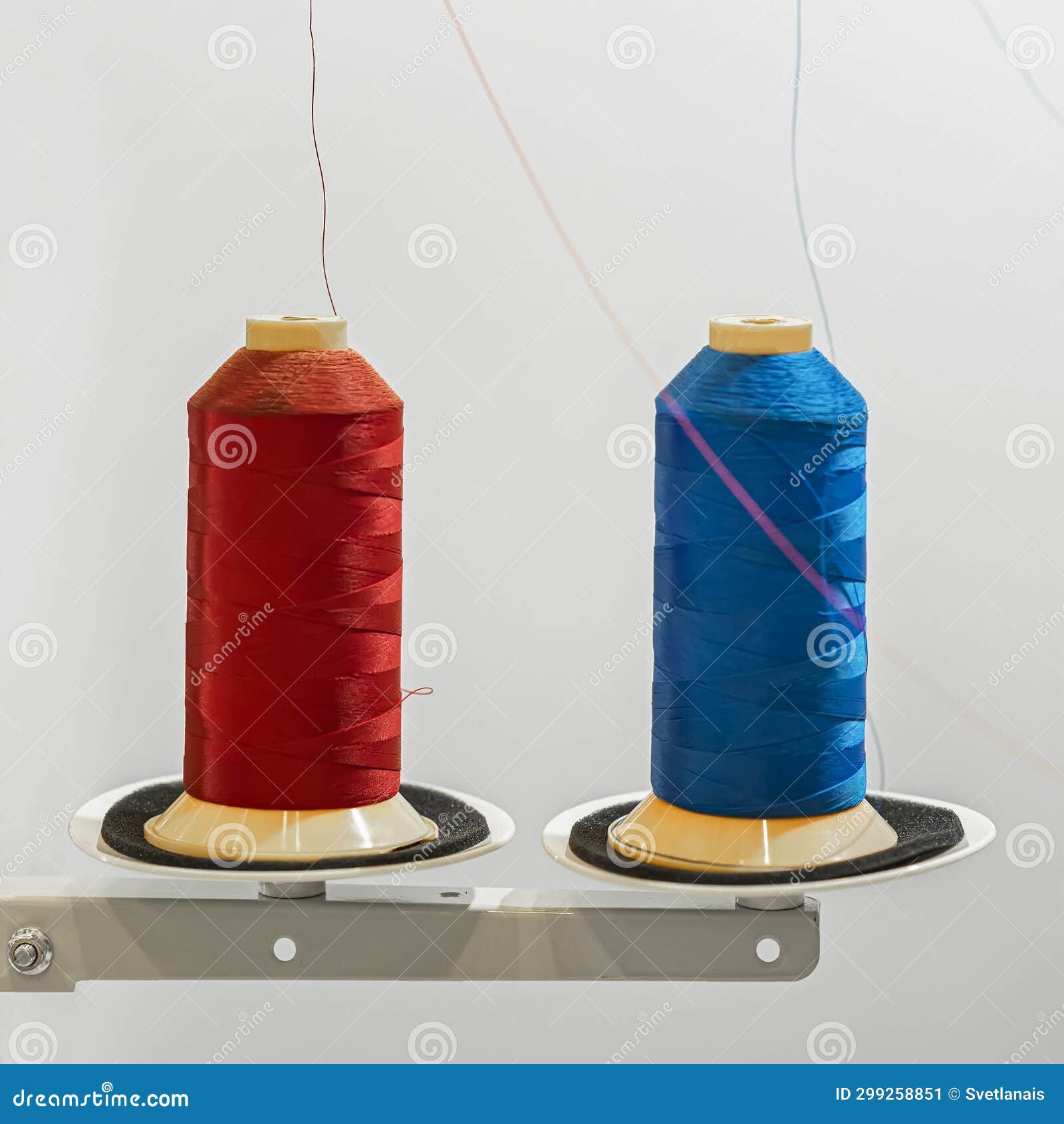 Close-up of Two Spools of Red and Blue Thread for Sewing Textiles ...