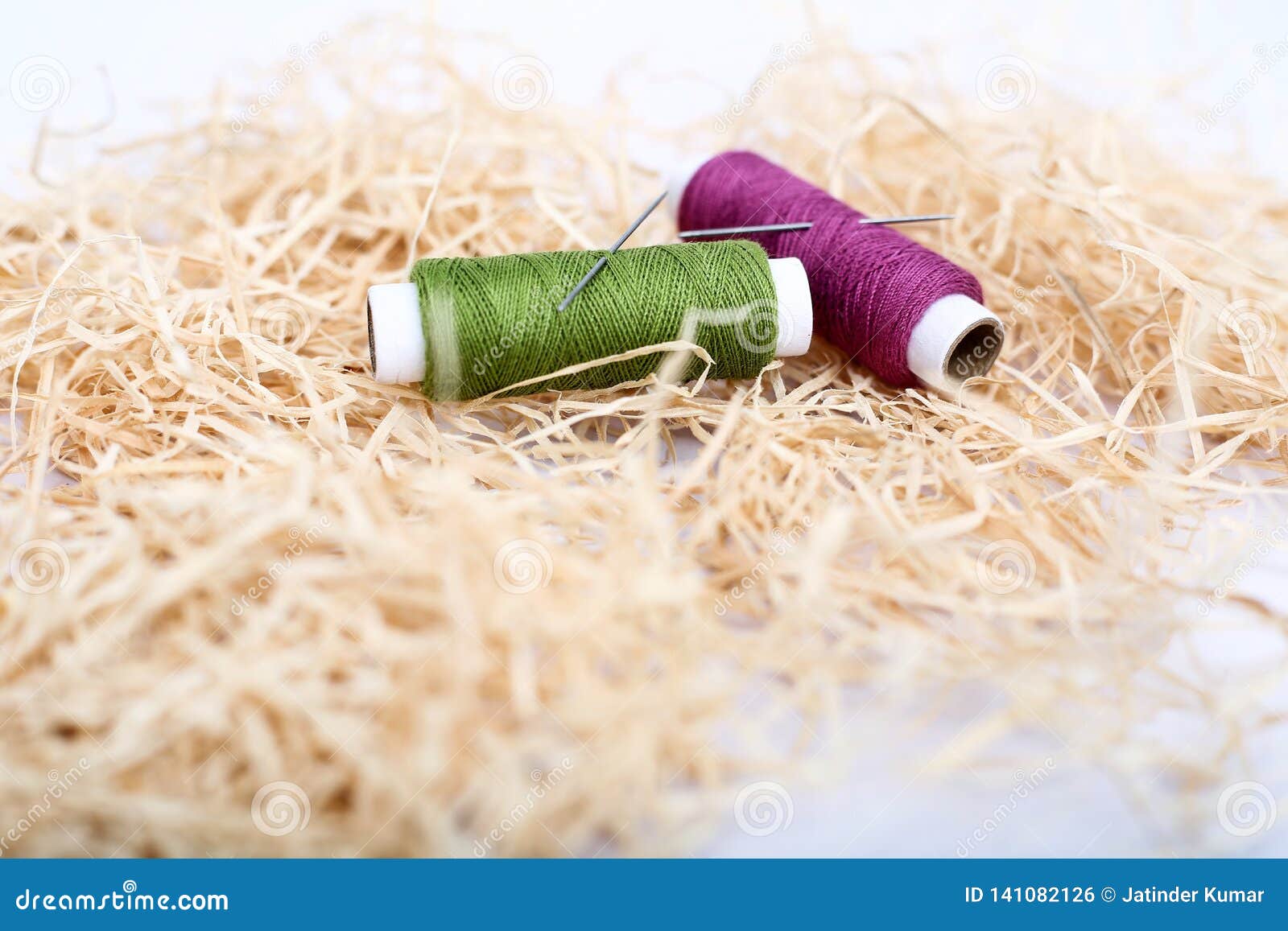 Spool of Two Thread with Needle Stock Photo - Image of fabric, bobbin ...