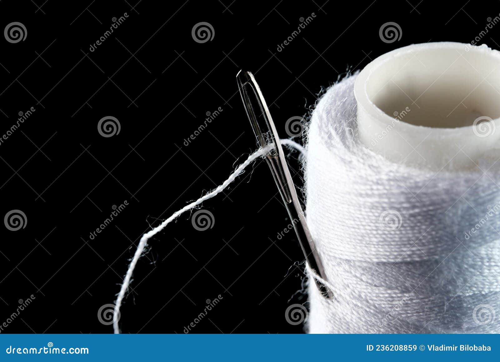 A Spool of White Thread and a Needle Stock Image - Image of homemade ...