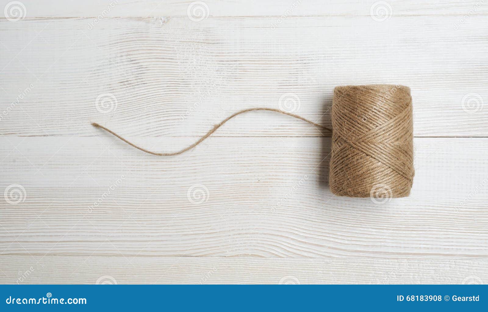 Spool of Wool Thread on a White Wooden Background. Top View Desktop ...