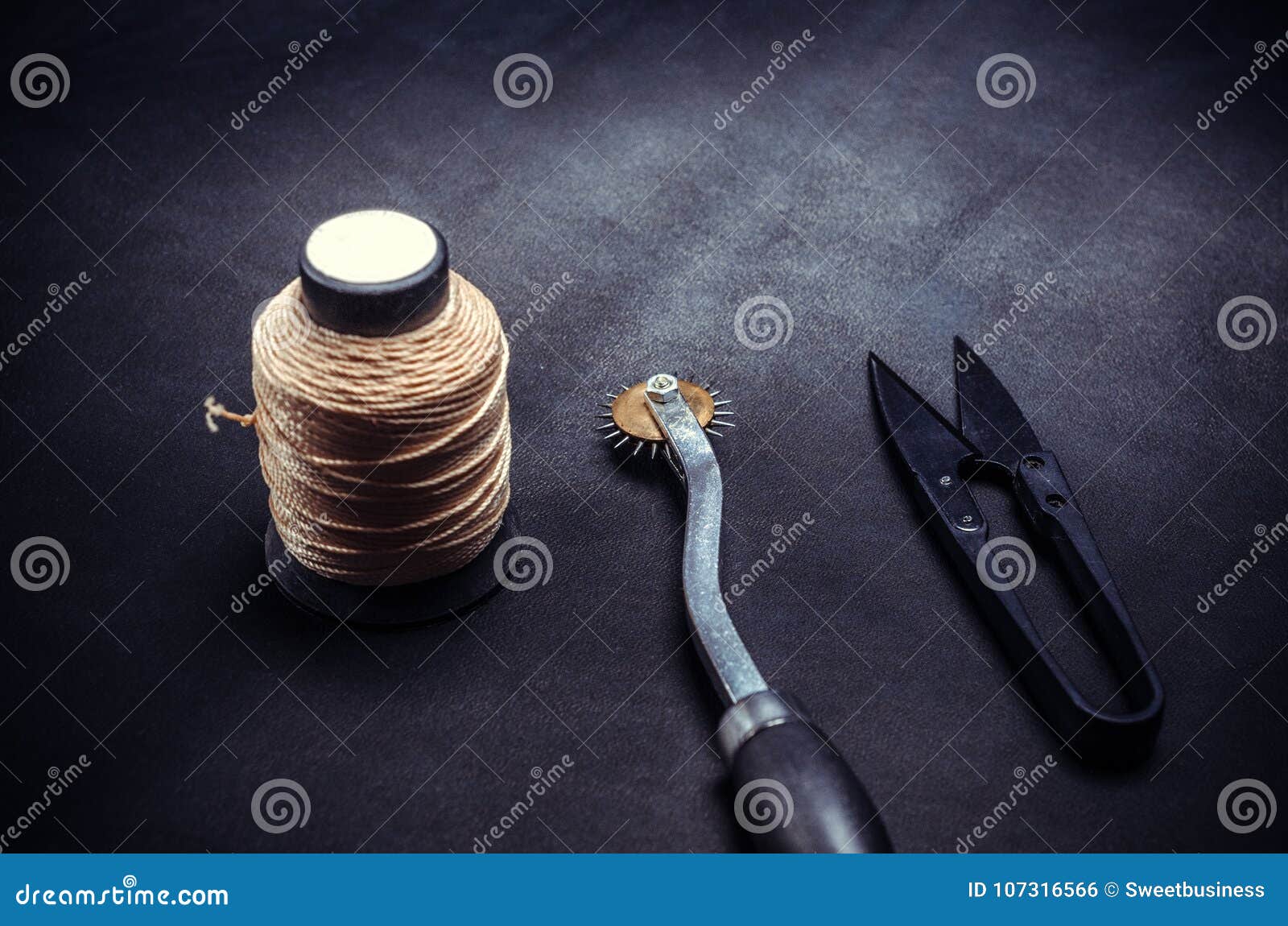 Spool of Yellow Threads and Tools on Black Background Stock Photo ...