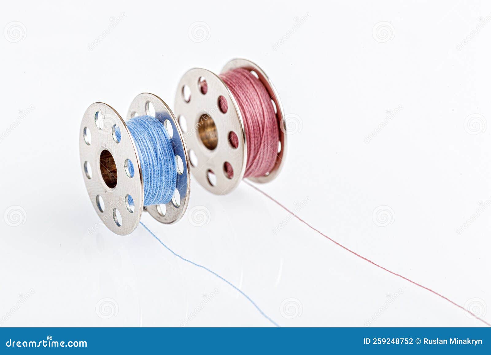 Spools of Blue and Pink Thread on a White Background Stock Photo ...