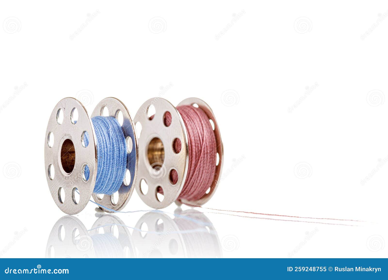 Spools of Blue and Pink Thread on a White Background Stock Image ...