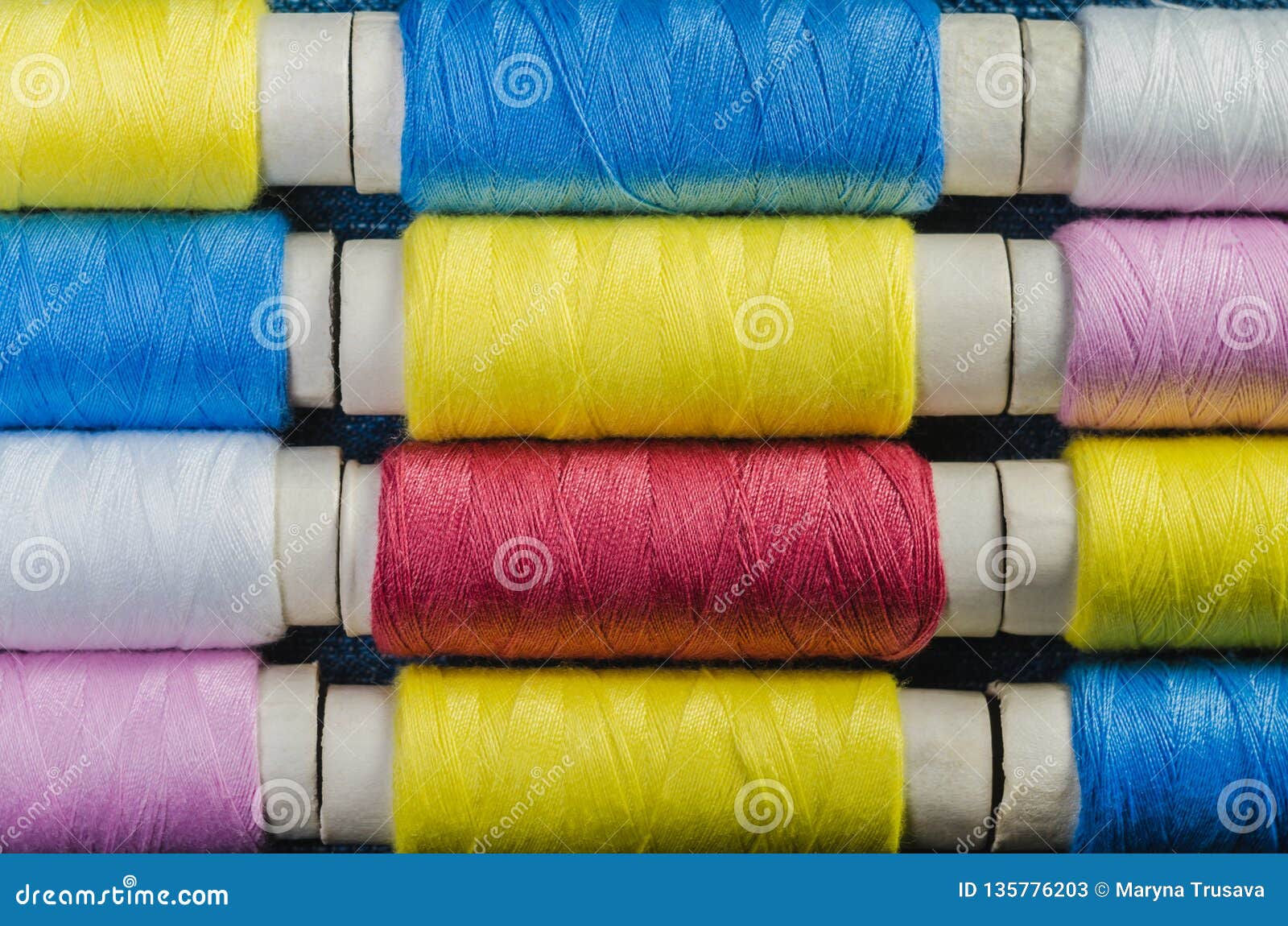 Spools of Multi-colored Threads Arranged in Rows Stock Image - Image of ...