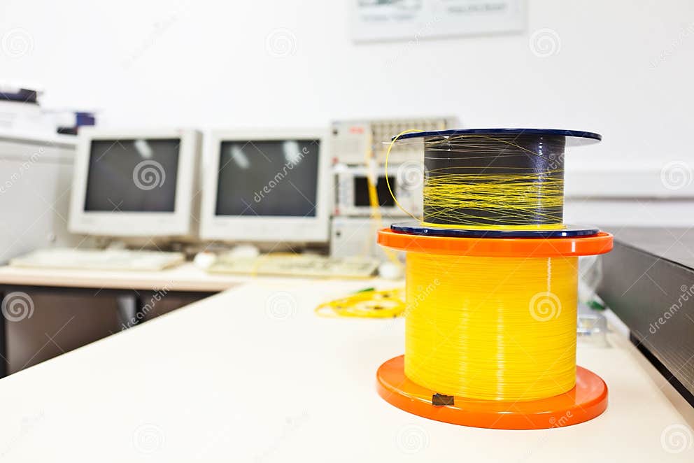 Spools of Optic Fiber Cable on the Desk Stock Image - Image of light ...