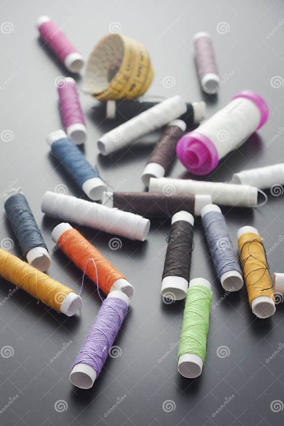 Spools of Sewing Thread on Gray Stock Image - Image of dressmaking ...