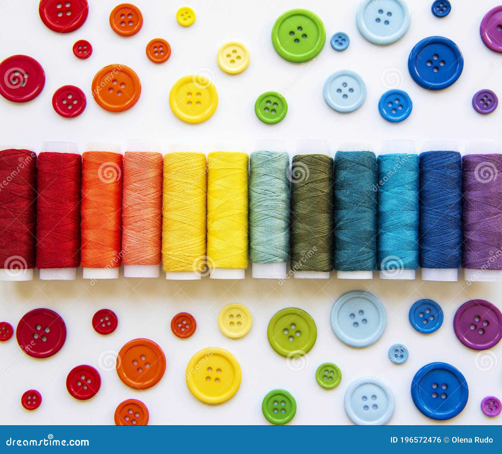 Spools of Thread and Buttons on the Colors of the Rainbows Stock Photo ...