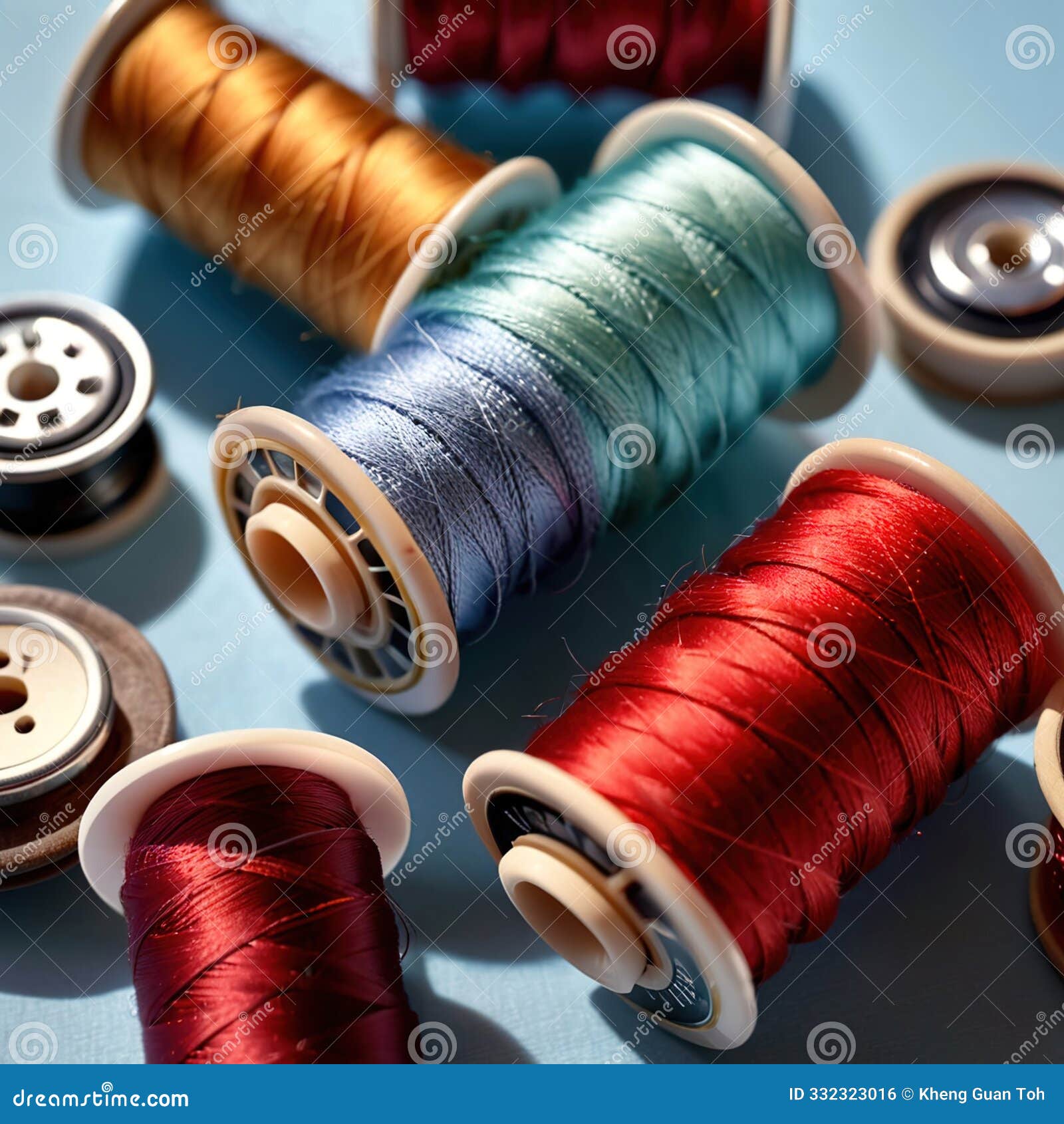 Spools of Thread and Buttons on Light Blue Background Stock ...