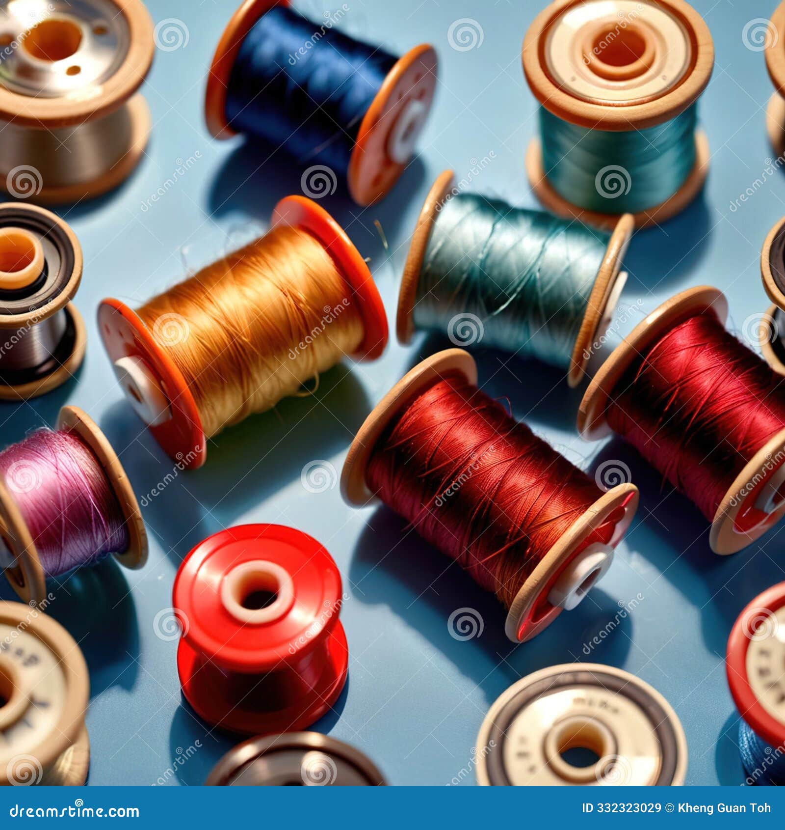 Spools of Thread and Buttons on Light Blue Background Stock ...