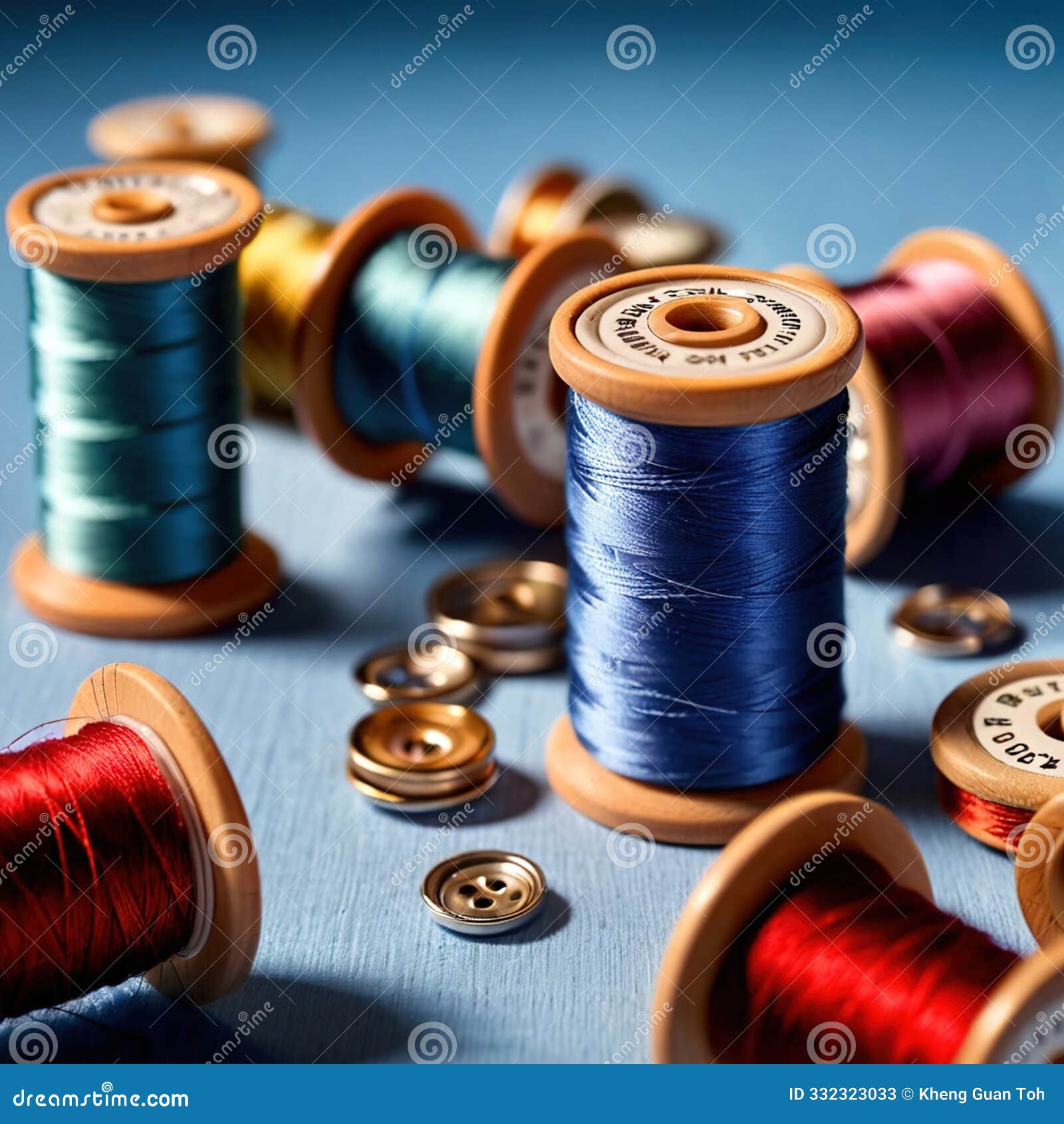 Spools of Thread and Buttons on Light Blue Background Stock ...