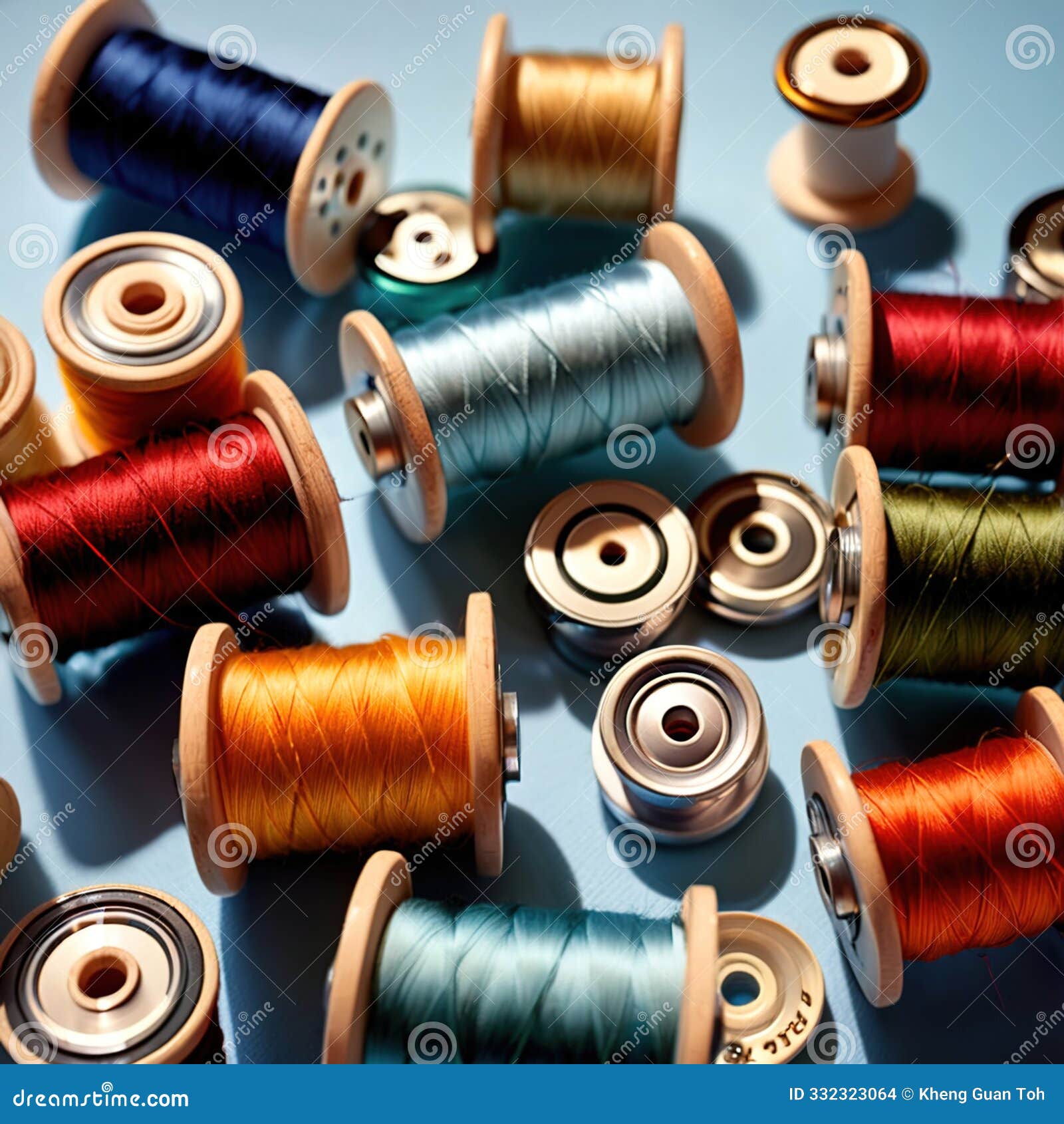 Spools of Thread and Buttons on Light Blue Background Stock ...