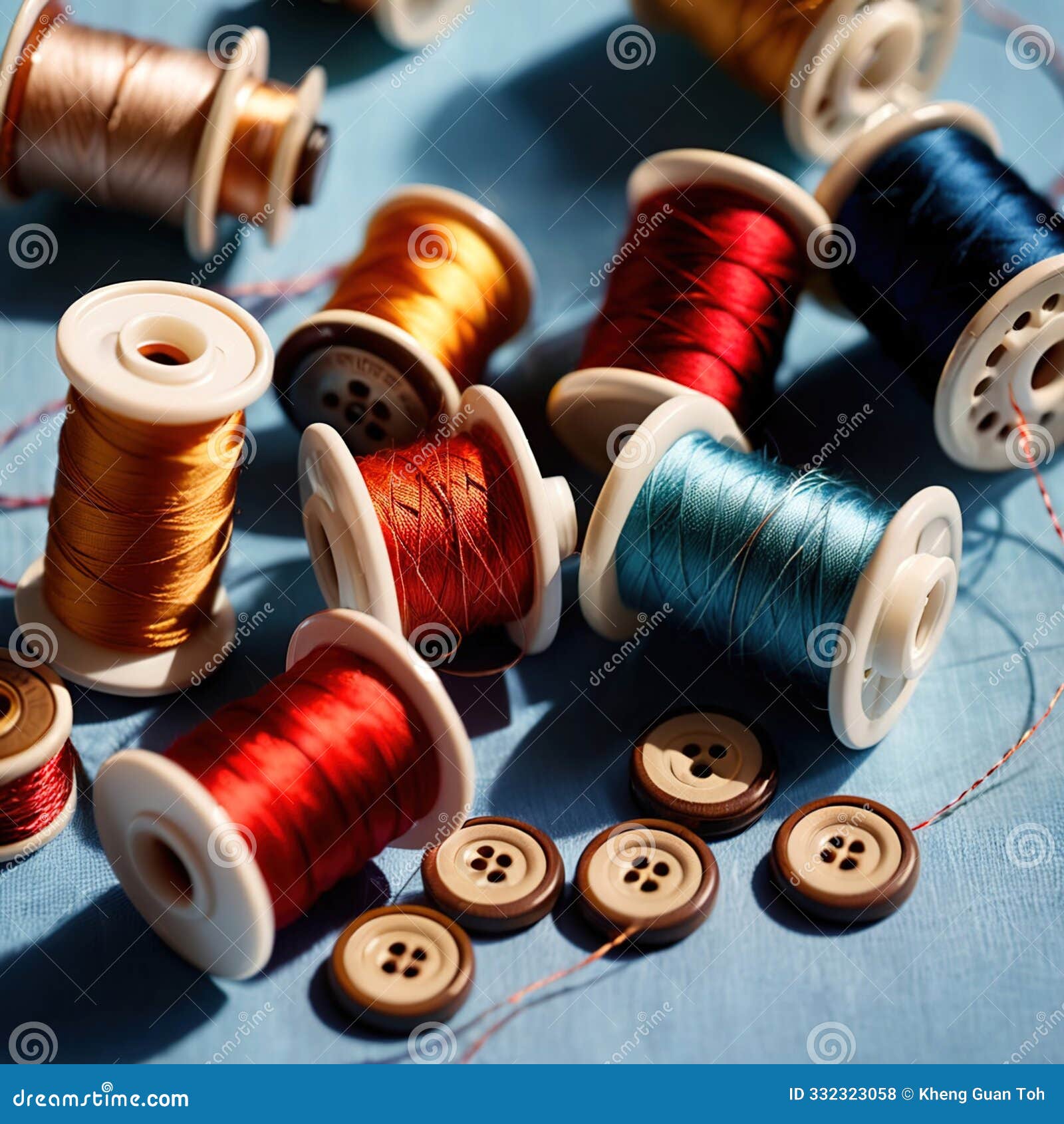 Spools of Thread and Buttons on Light Blue Background Stock ...