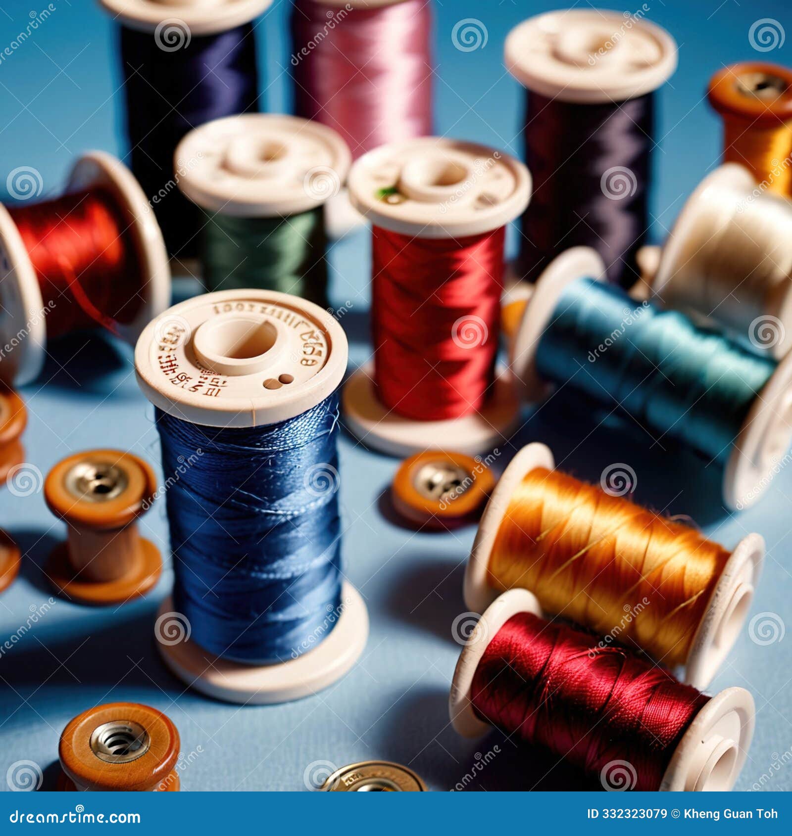 Spools of Thread and Buttons on Light Blue Background Stock ...