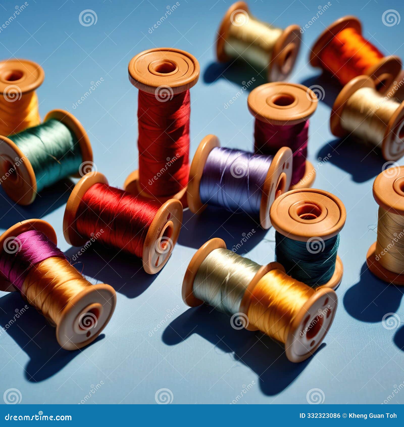 Spools of Thread and Buttons on Light Blue Background Stock ...