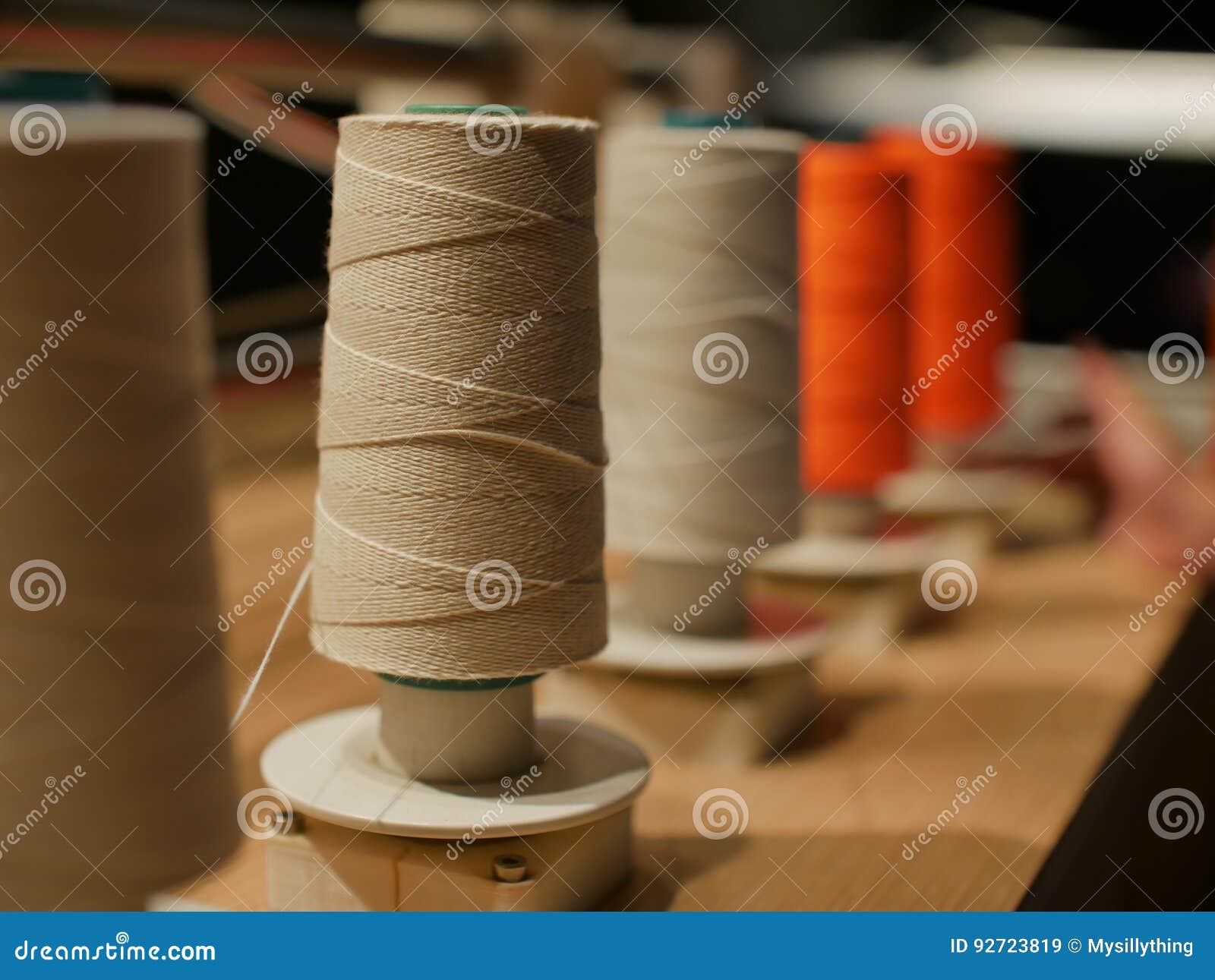 Spools of Thread Display on Wood Table in Factory Stock Image - Image ...