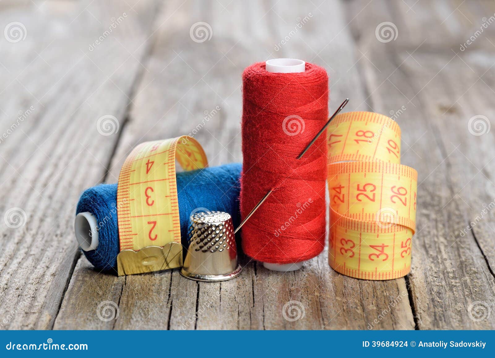 Spools of Thread, Needle, Measuring Tape and Thimble Stock Photo ...