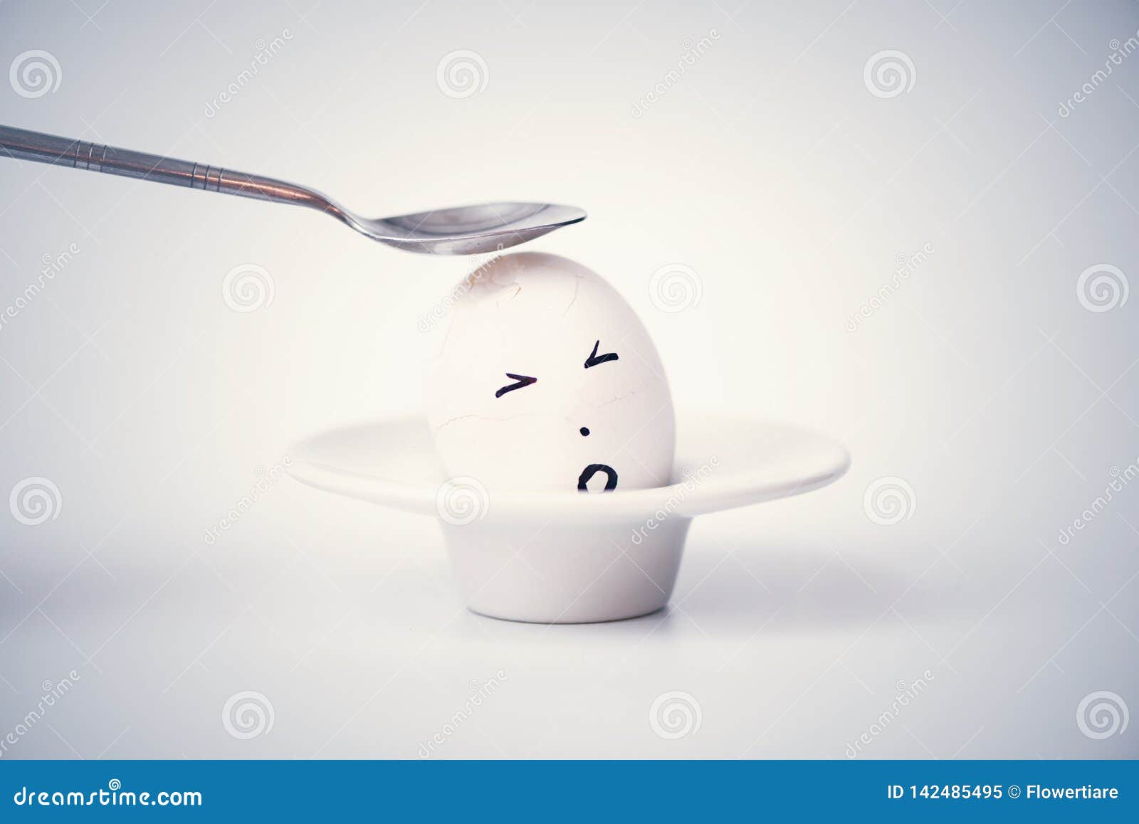 Spoon Breaks Sad Egg on a Stand in the Form of Human Head . Stock Image ...