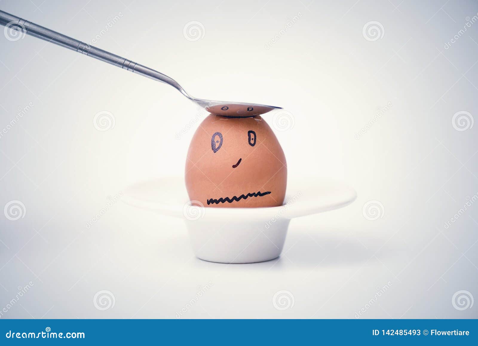 Spoon Breaks Sad Egg on a Stand in the Form of Human Head . Stock Image ...