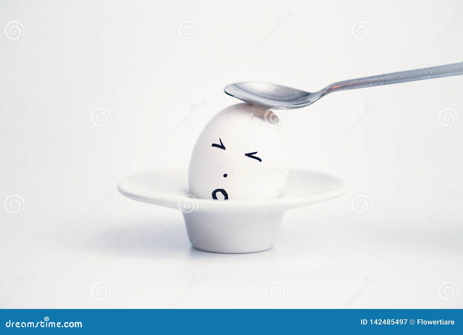 Spoon Breaks Sad Egg on a Stand in the Form of Human Head . Stock Image ...