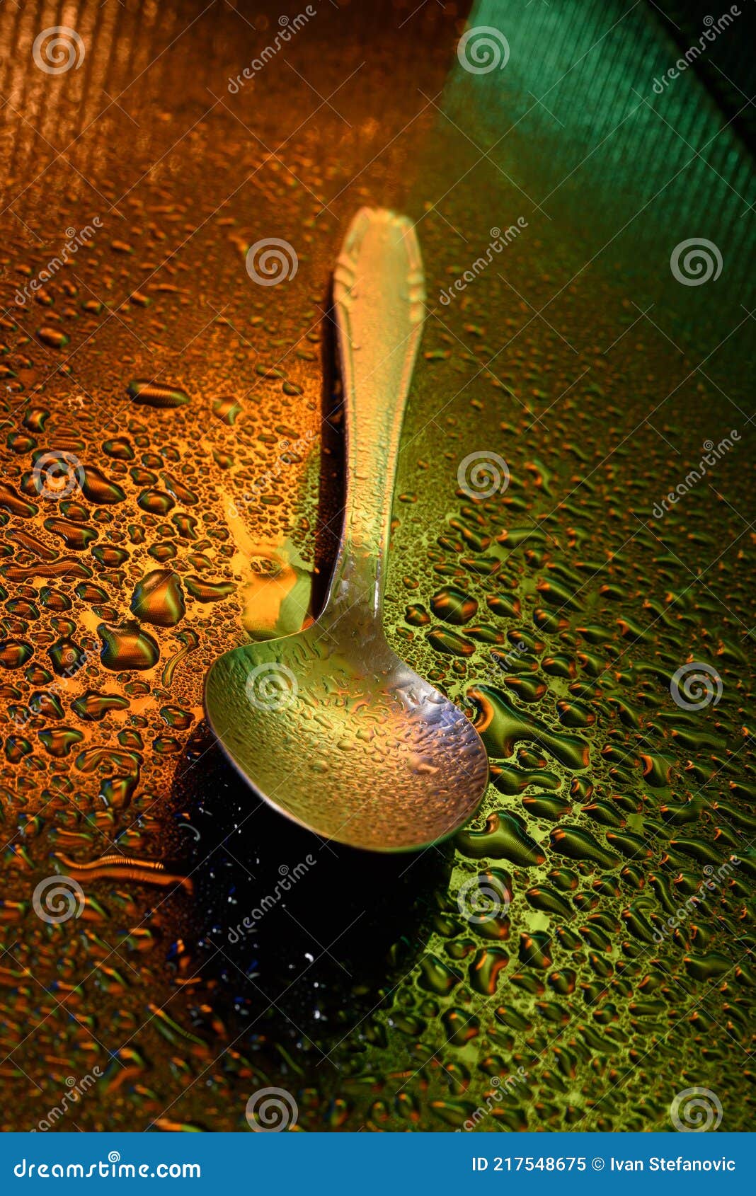 Spoon in color reflection. stock image. Image of light - 217548675