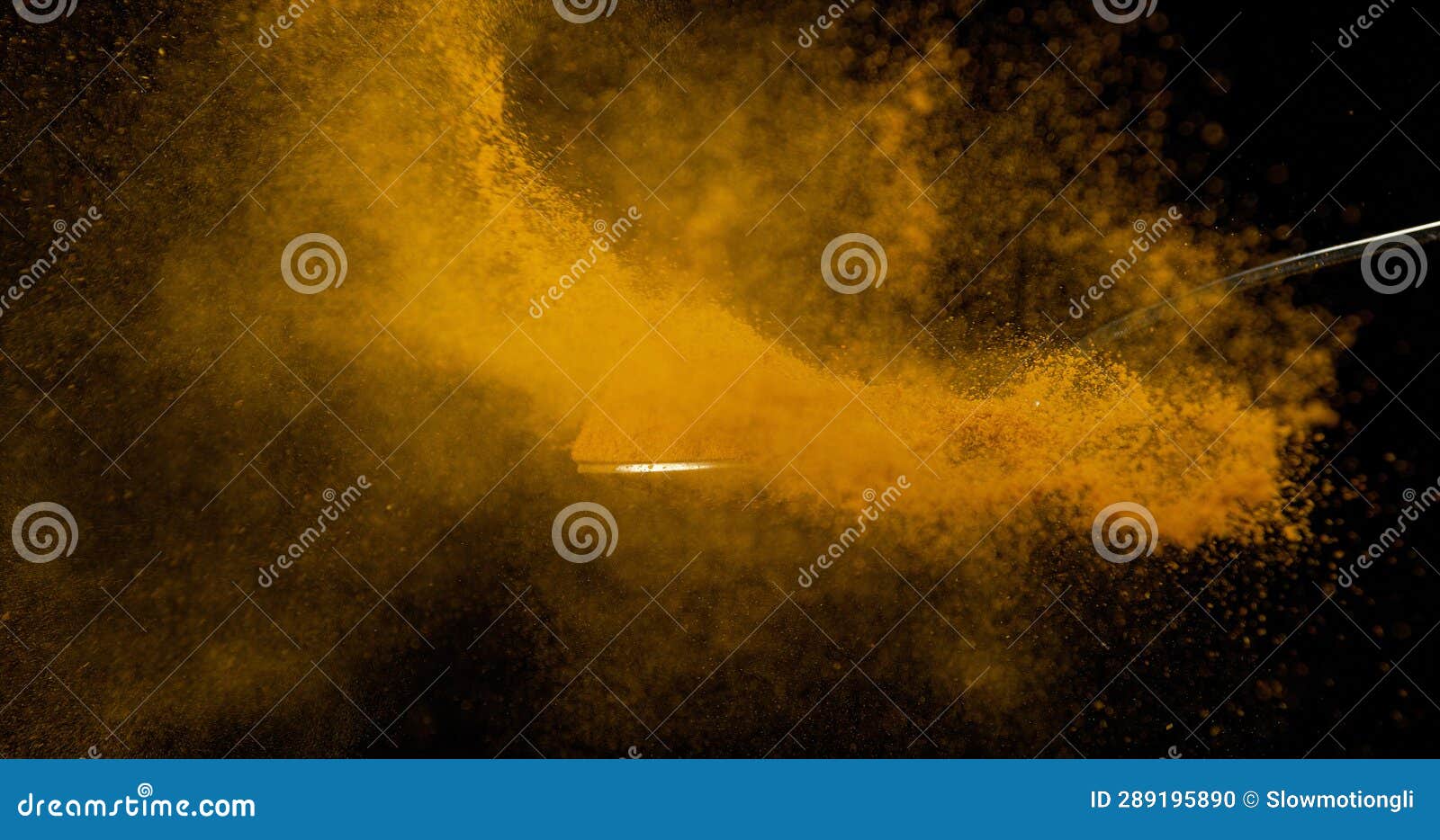 Spoon and Curry Powder Falling from Spoon Against Black Background ...