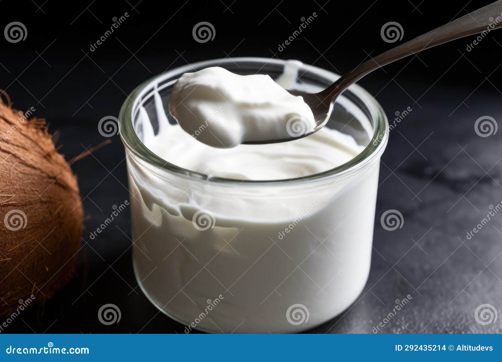 Spoon Digging into a Container of Coconut Yogurt Stock Photo - Image of ...