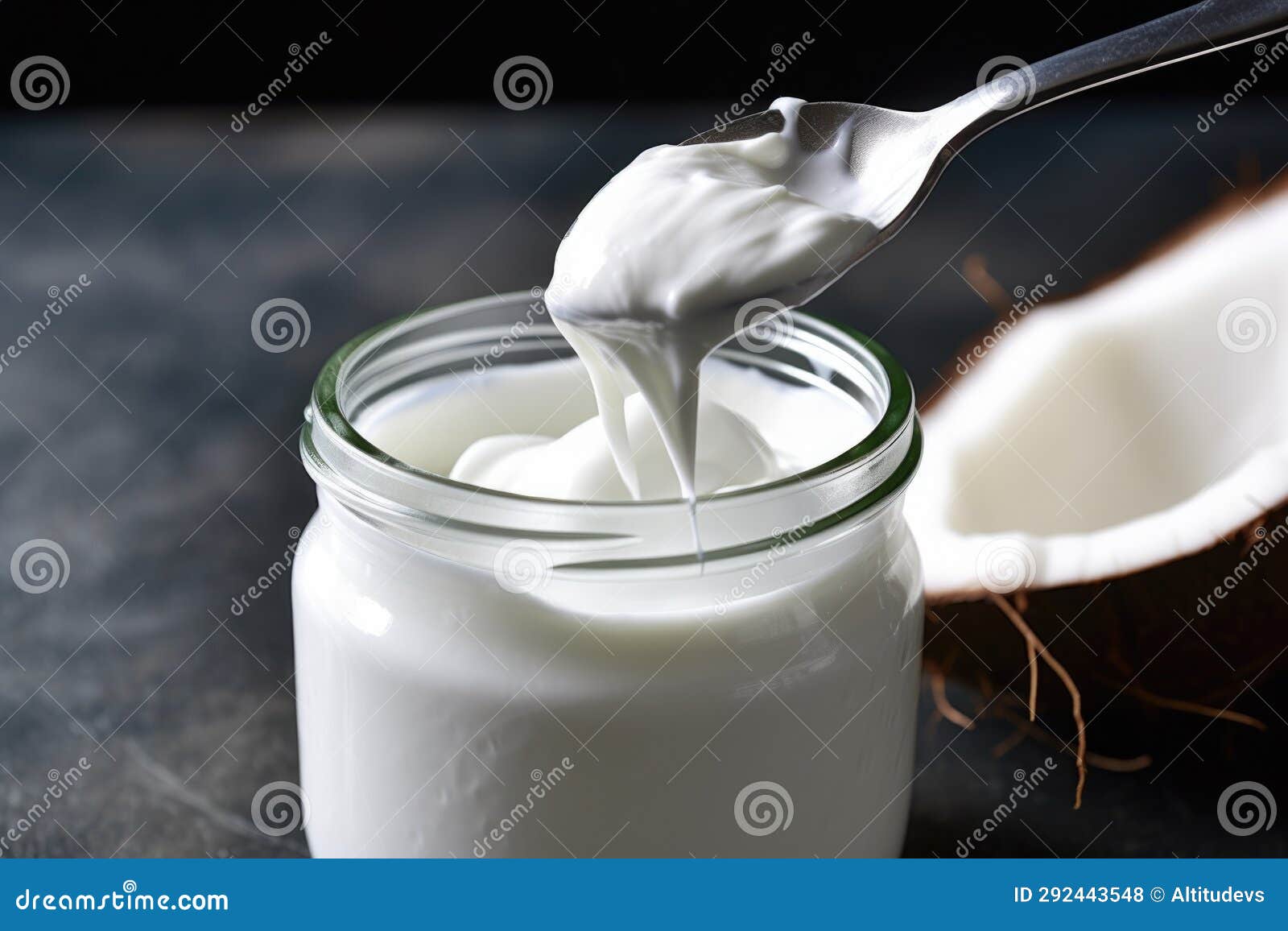 Spoon Digging into a Container of Coconut Yogurt Stock Photo - Image of ...