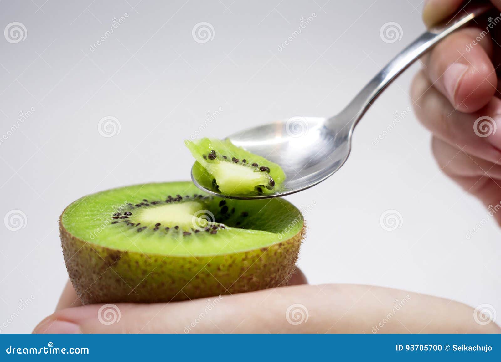 Spoon Feeding a Kiwi stock photo. Image of fruits, freshness - 93705700