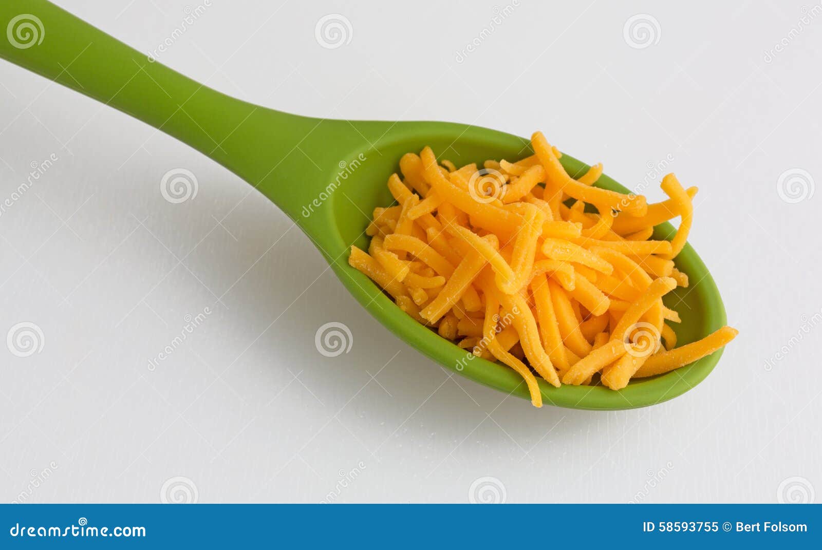 Spoon Filled with Shredded Sharp Cheddar Cheese Stock Image - Image of ...