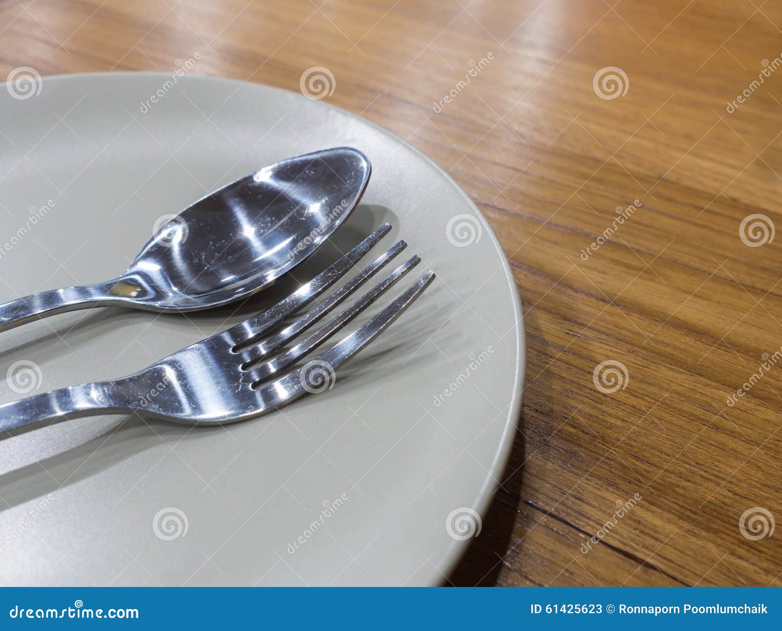 Spoon and fork on plate stock image. Image of dish, flatware - 61425623