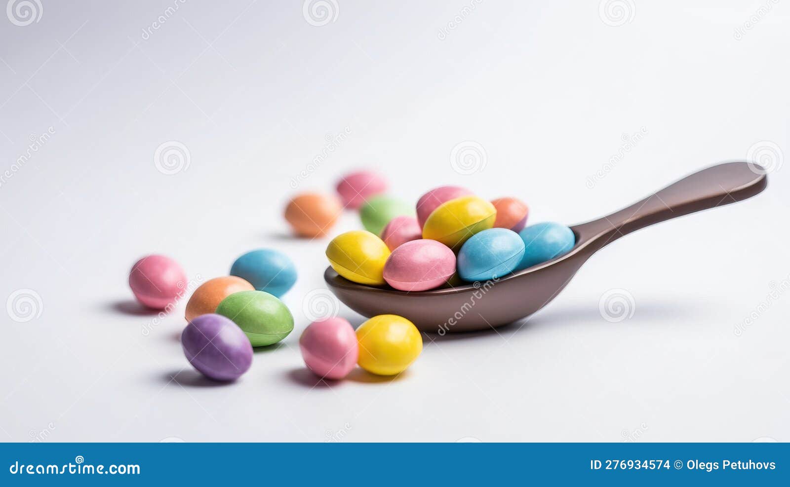 A Spoon Full of Colorful Candies on a White Table Top with a Spoon Full ...