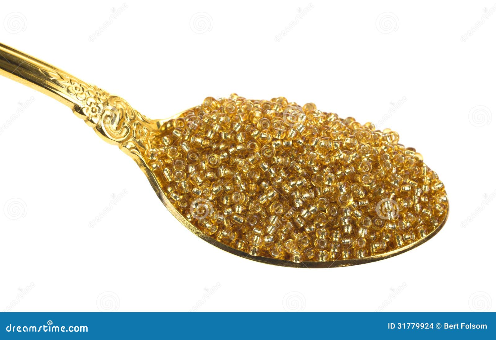 Spoon Full of Gold Glass Beads Stock Photo - Image of decorative ...
